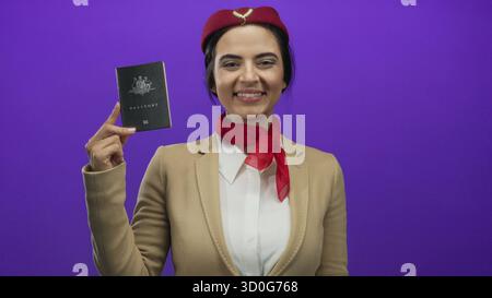 Young hispanic woman holding australian flag and passport puffing ...