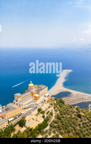 Aerial view of the golden-domed Basilica Santuario Maria del Tindari ...