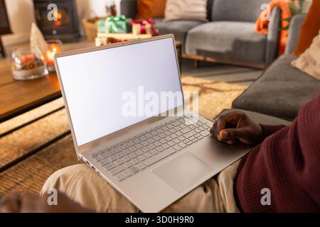 Candles and laptop on table in bedroom Stock Photo - Alamy