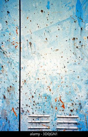 Abstract textured composition of a transformer station door in cyan ...