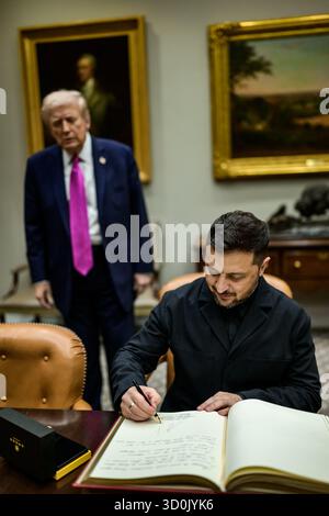President Donald Trump looks on as he boards Air Force One for a trip ...
