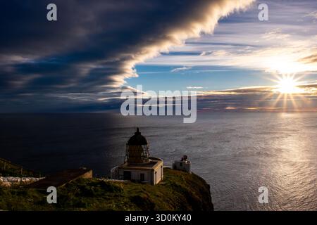 St Abbs lighthouse at sunrise with golden hour light. located in ...