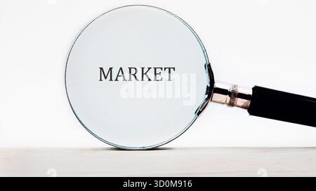 Image of magnifying glass with pricing strategy text over computer ...