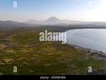 Aerial view of Lake Natron meeting the volcanic landscape near the ...