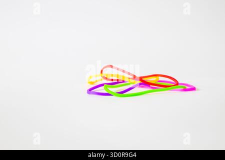Some colorful Rubber Bands arranged on a white background Stock Photo ...