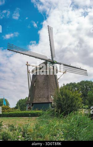 Low angle view of traditional windmill against sky Stock Photo - Alamy