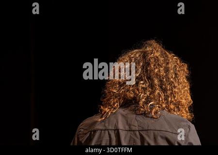 Hidden Curls. Black space, background. Monochrome Hues Stock Photo - Alamy