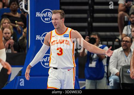Atlanta Hawks guard Luke Kennard (3) shoots as Orlando Magic guard Tyus ...