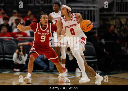 Wisconsin guard Braeden Carrington dribbles the ball during the second ...