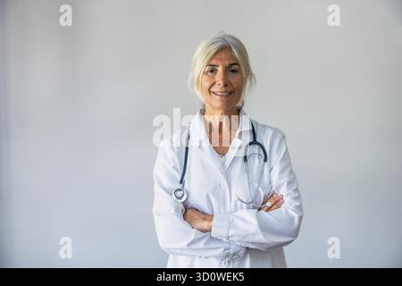 Caucasian senior female doctor confidently with stethoscope Stock Photo ...