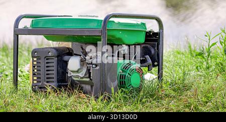 Portable gas generator providing emergency power supply on a snowy city ...