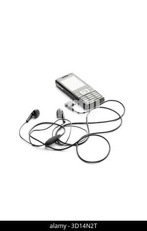 Object on white - mobile phone with head set Stock Photo - Alamy
