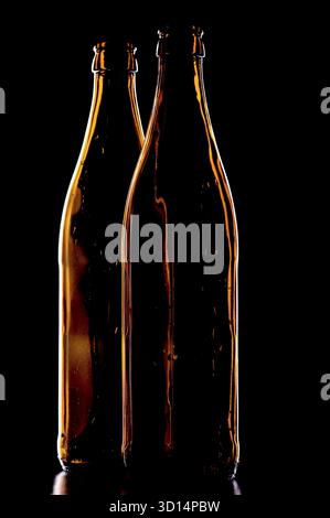 Empty orange beer bottle isolated Stock Photo - Alamy