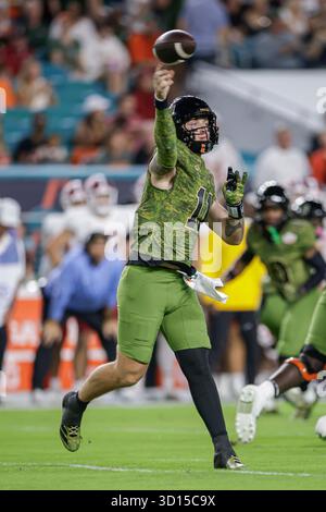 Miami quarterback Carson Beck (11) passes the football during the first ...