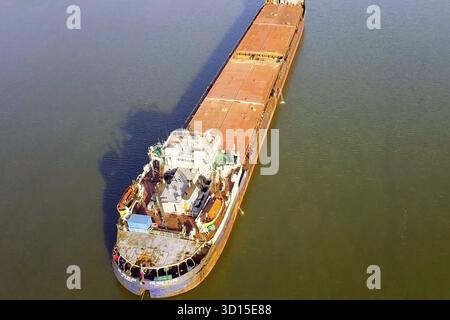 A cargo barge floats along the river. Cargo ship Stock Photo - Alamy