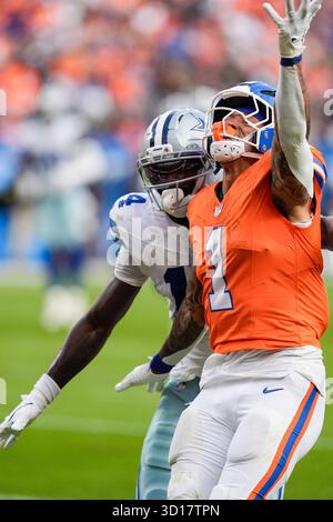 Denver Broncos tight end Evan Engram (1) runs with the ball against the ...