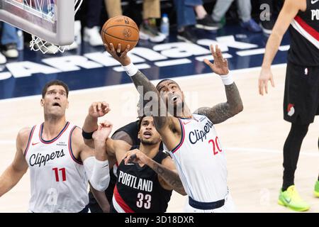 LA Clippers' John Collins (20) defends Brooklyn Nets' Danny Wolf (2 ...
