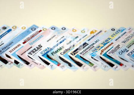 Big amount of driving licenses from different USA states. Stack of ...