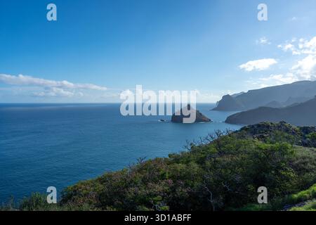 The rugged cliffs of Taiohae Bay in Nuku Hiva, Marquesas Islands, drop ...