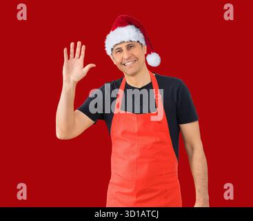 Adult barista wearing red apron pulling lever on espresso machine at ...