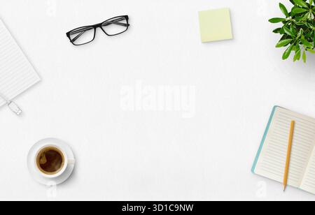 Top view with notebook,glasses,pencil and cup of coffee on office desk ...