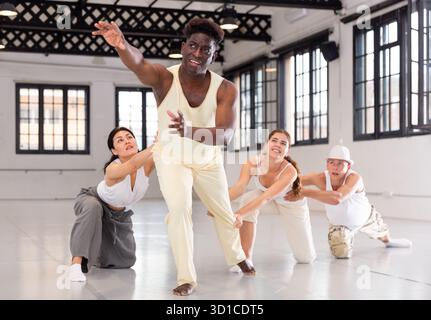 Dancers on stage, choreography with elements of theatrical production ...