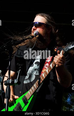 Rock band portrait with rockstar guitar player of different age Stock ...