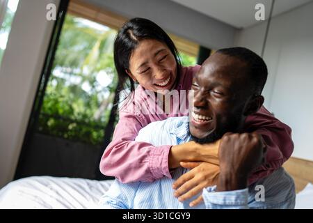 Happy diverse couple enjoying meaningful moments together, embracing ...