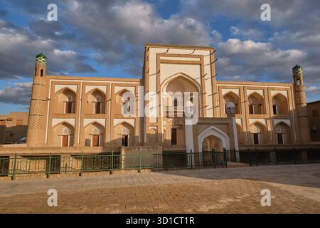 The front facade, entrance of the white Amir tura Madrasah muslim ...