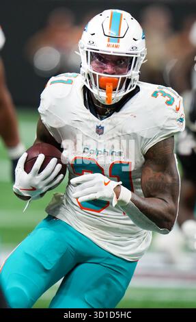 Miami Dolphins running back Ollie Gordon ll (0) runs drills during an ...