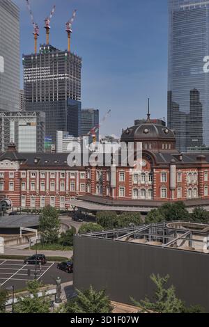 The Iconic Red Brick Tokyo Station with Skyscrapers - Japan Stock Photo ...