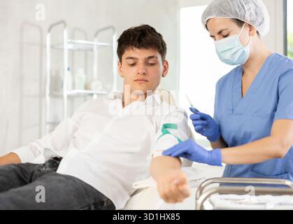 Intravenously injection male patient Stock Photo - Alamy