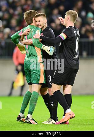 from left: Eric Smith, Karol Mets, goalkeeper Nikola Vasilj (St. Pauli ...