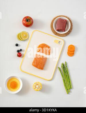 Raw beef and vegetables assortment on wooden desk, cooking ingredients ...