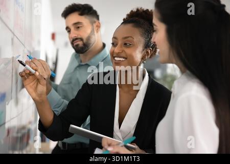 Happy black man, whiteboard and schedule planning with ideas in ...
