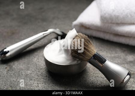 Different barber's tools on grey wooden table, closeup Stock Photo - Alamy