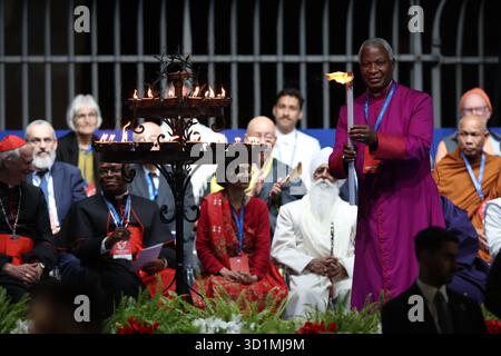 Pope Leo XIV light a candle as he visits the San Pietro in Ciel d'Oro ...