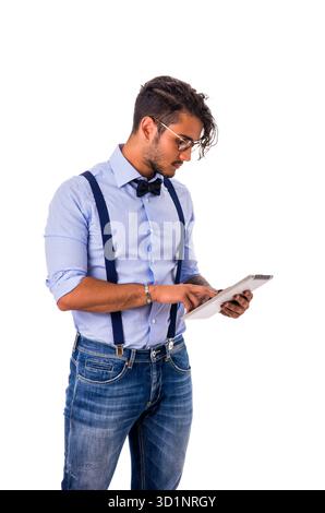 Handsome man in shirt, suspenders, hat and glasses in studio Stock ...