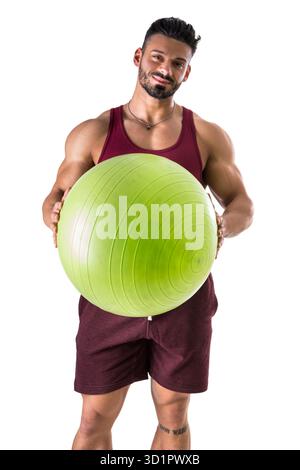 Muscular man holding inflatable fitness ball Stock Photo - Alamy