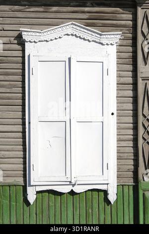 Old white painted framed window on a wood building Stock Photo - Alamy