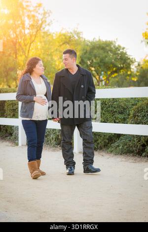 Young latin couple expecting baby surprise with gift at street Stock ...