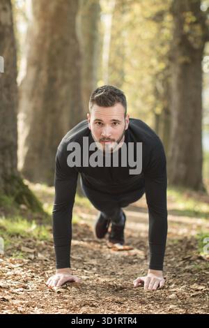 Sportsman doing push-up exercises in desert Stock Photo - Alamy