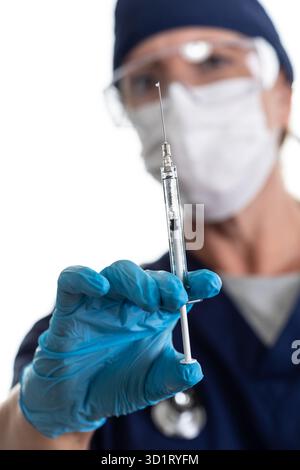 doctor with gloves while administering the vaccine on the arm of the ...
