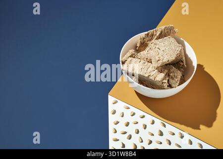 Turkish Halva with sunflower seeds and honey in wooden tray. Wooden background. Top view Stock ...