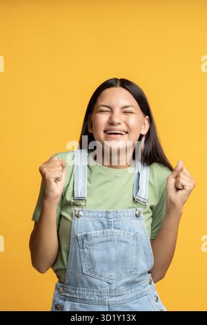 Amazed teen girl. Excited expression, cheerful and glad. Joy, victory ...