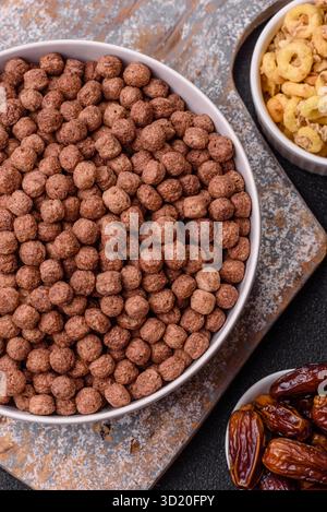 Chocolate Corn balls in bowl over yellow background Stock Photo - Alamy