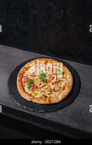 Freshly baked pizza on dark background. Tasty homemade food concept ...