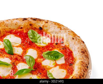 A plate of Margherita pizza and basil on black wooden table Stock Photo ...