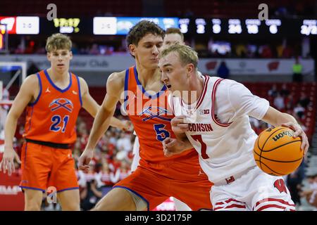 Wisconsin guard Andrew Rohde (7) drives past Providence guard Jason ...