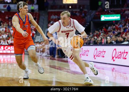 Wisconsin guard Andrew Rohde (7) drives past Providence guard Jason ...